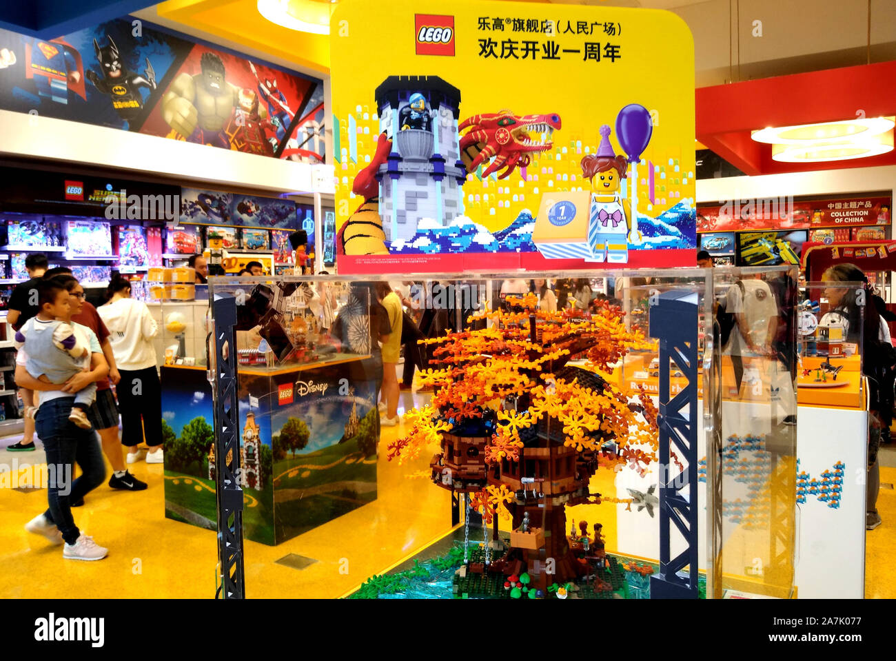 Consumers stroll and observe new LEGO models exhibited as the first ...