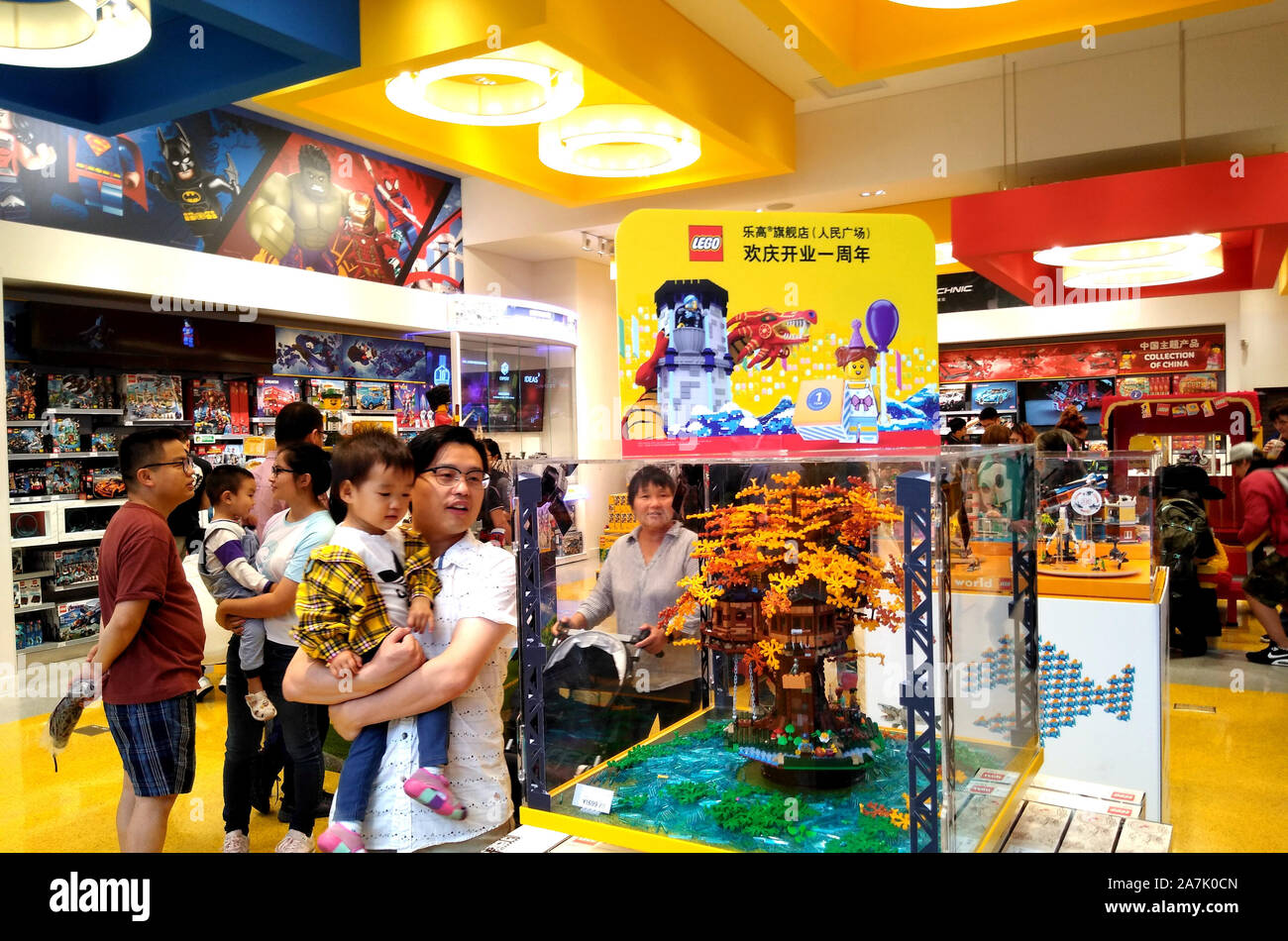 Consumers stroll and observe new LEGO models exhibited as the first ...