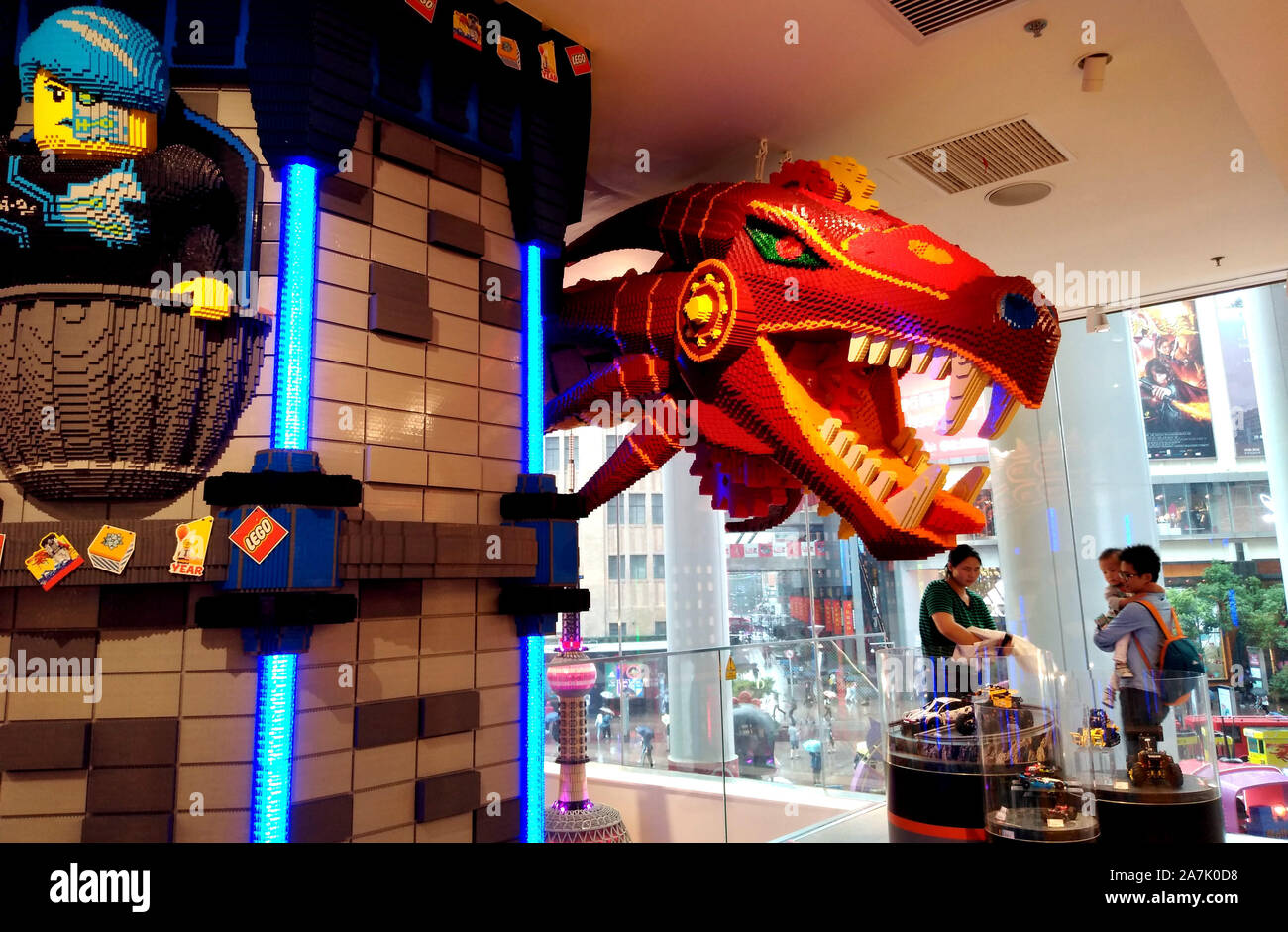 Consumers stroll and observe new LEGO models exhibited as the first ...