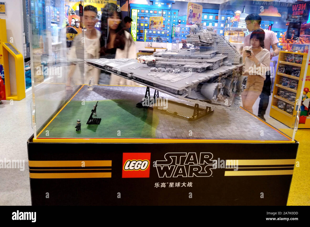 Consumers stroll and observe new LEGO models exhibited as the first ...