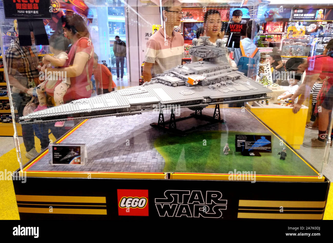 Consumers stroll and observe new LEGO models exhibited as the first ...