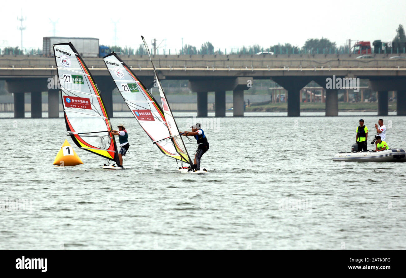 People windsurf at the Lilac Lake Park during the China's 11th ...