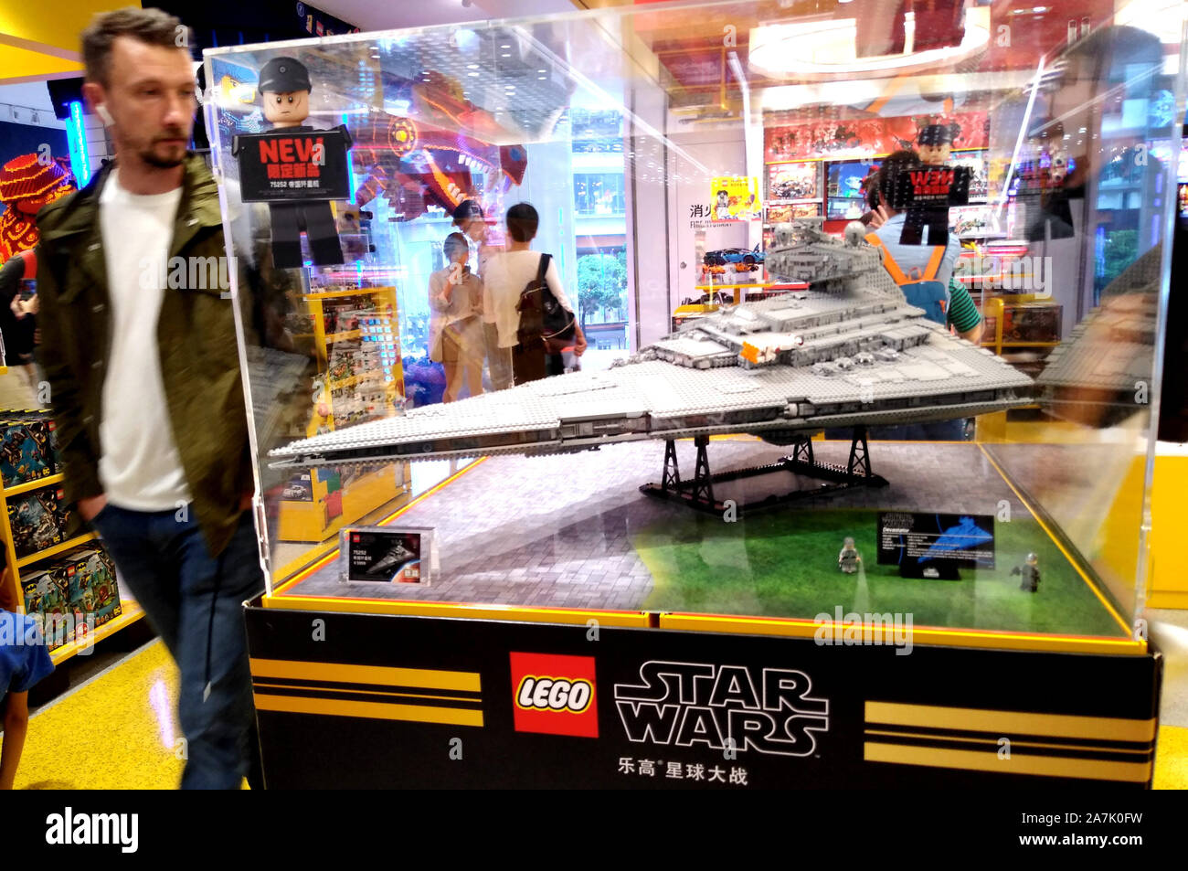 Consumers stroll and observe new LEGO models exhibited as the first ...