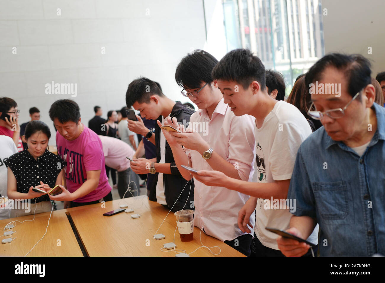 Customers try out iPhone 11 series smartphones at the East Nanjing Road ...