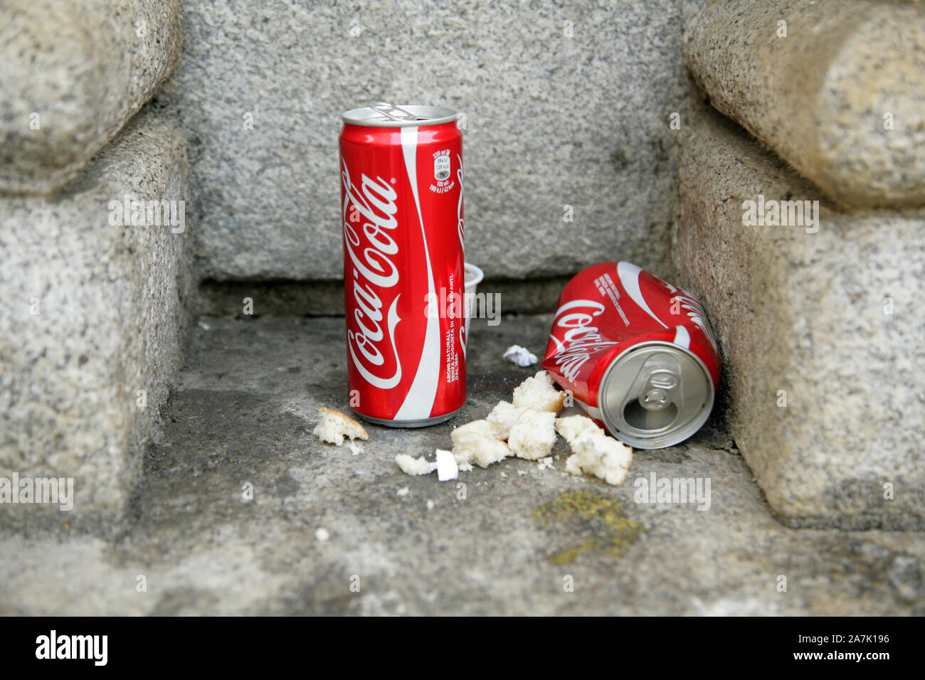 Two discarded Coca Cola soft drinks cans Stock Photo - Alamy