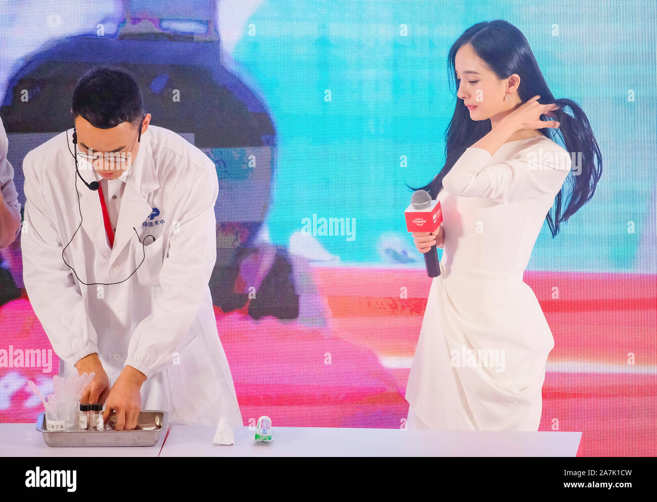 Chinese actress and singer Yang Mi, right, attends Colgate promotional ...