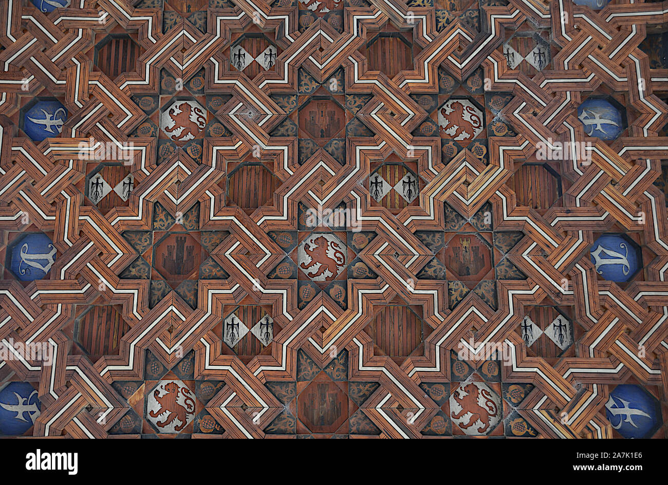 Background made with a decorative wooden ceiling with medieval coats of ...