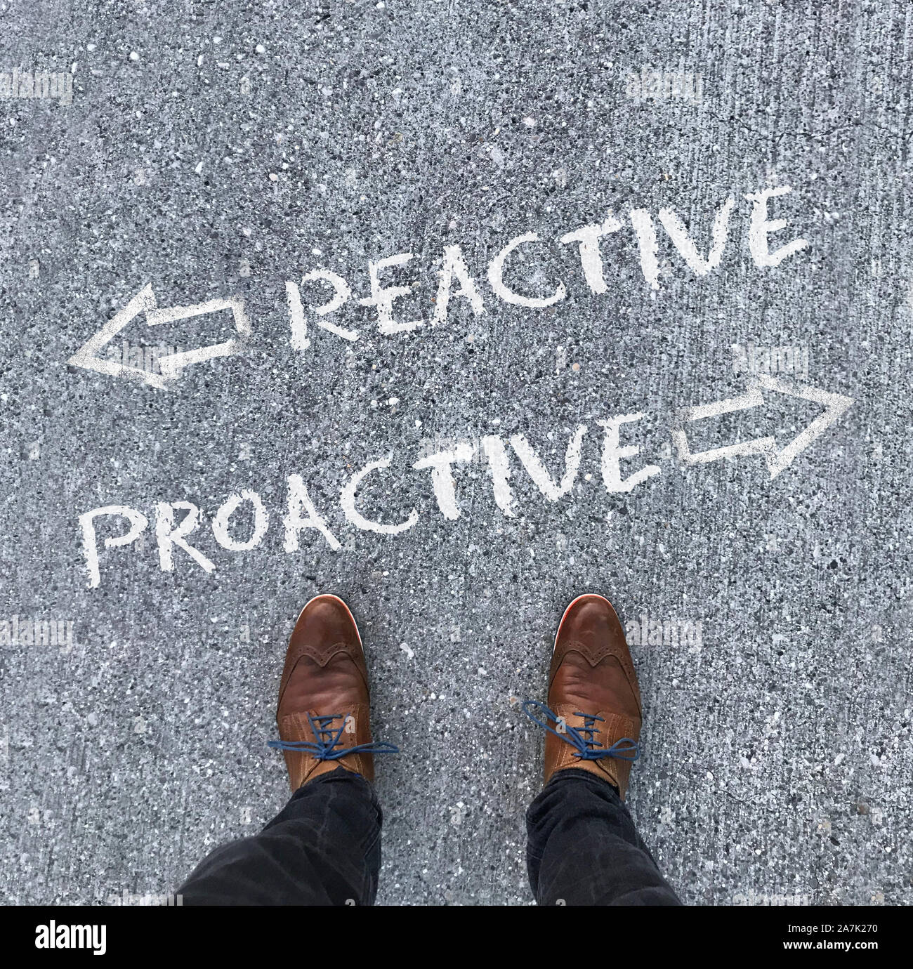 A man in leather shoes stands in front of the words "Reactive" and ...