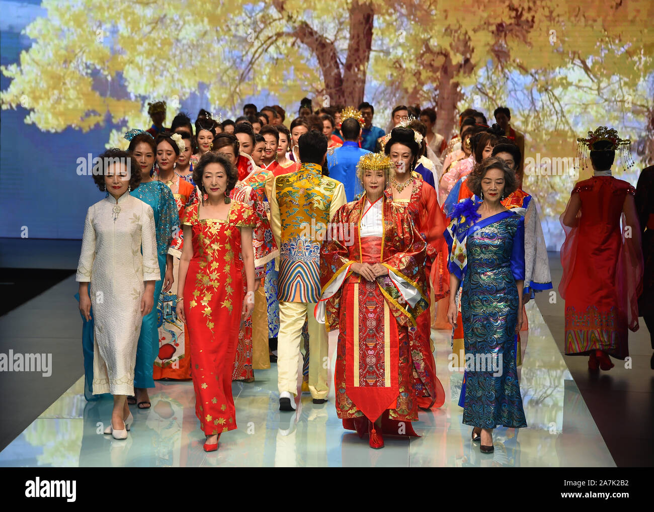 Elder models wearing traditional Chinese outfit designed by Chen Fumei ...