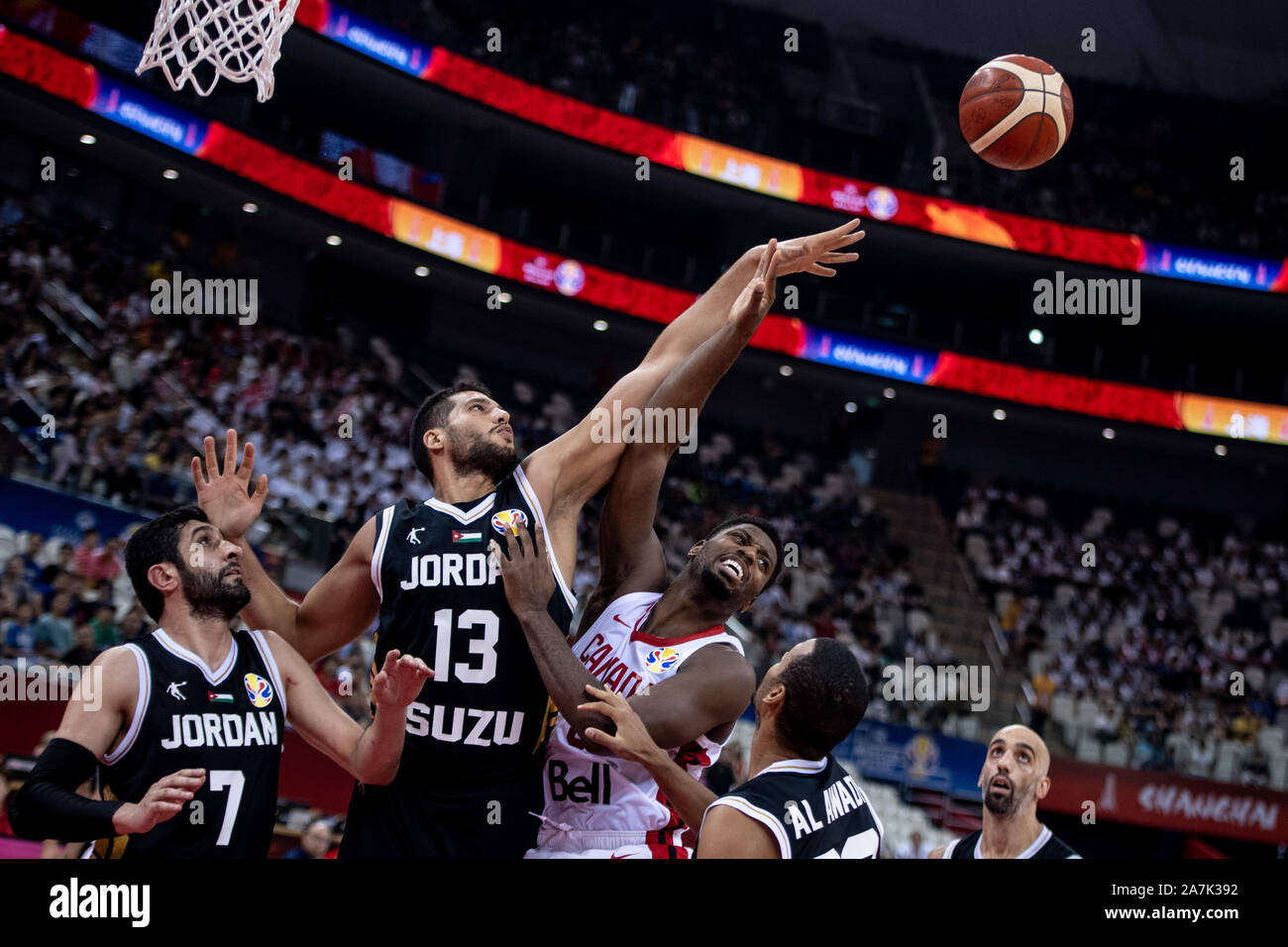 Jordanian professional basketball player Mohammad Hussein, middle ...