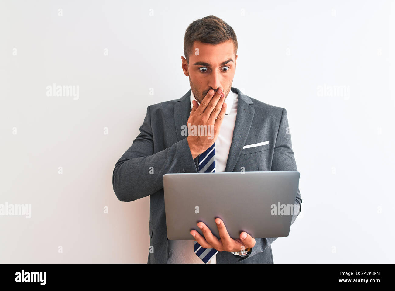 Young handsome business man working using computer laptop over isolated ...