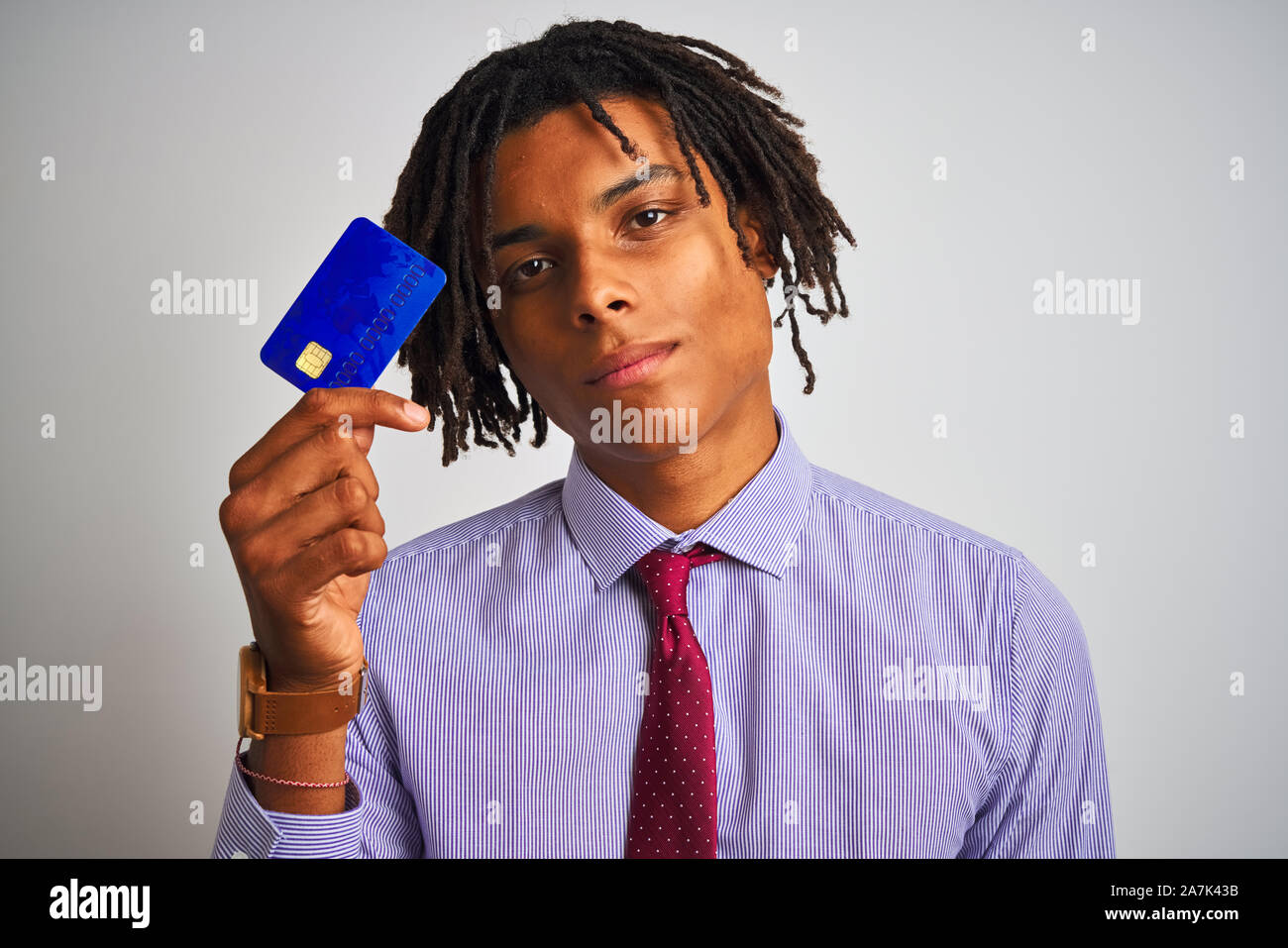 Afro american businessman with dreadlocks holding credit card over ...
