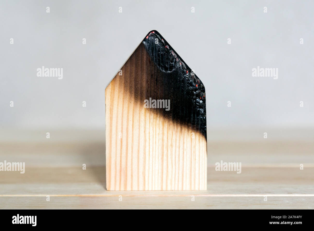 Burnt wooden board with coals and blackened by fire Stock Photo - Alamy