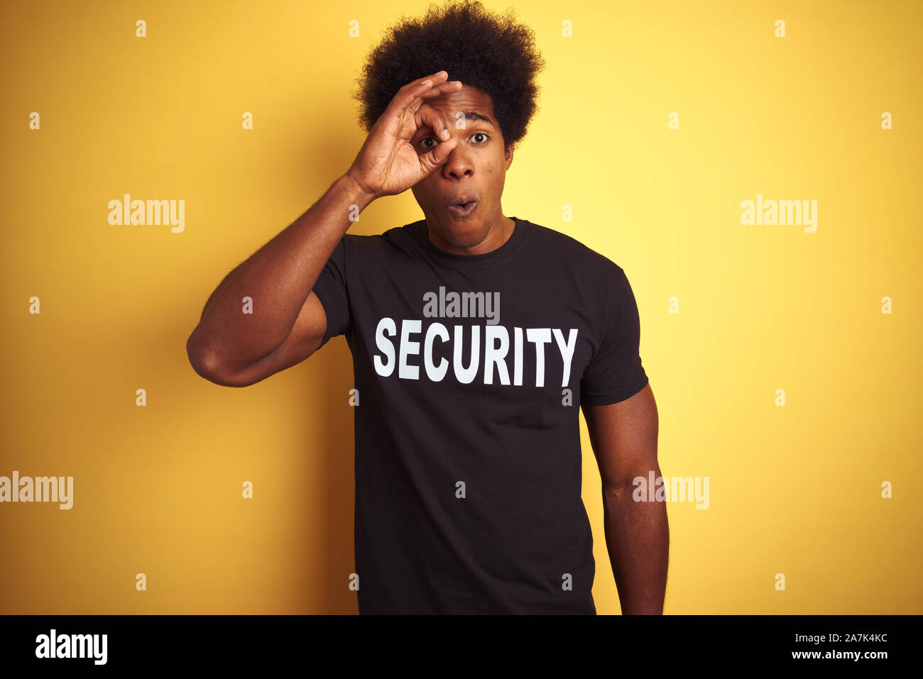 American safeguard man with afro hair wearing security uniform over ...