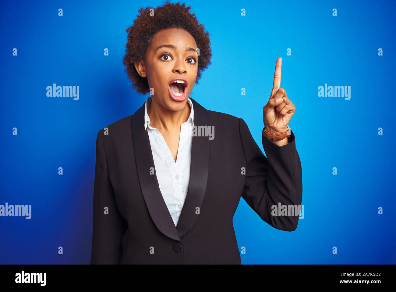 African american business executive woman over isolated blue background ...