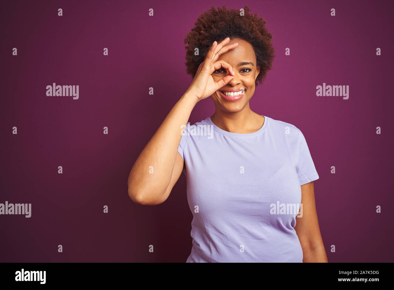 Young beautiful african american woman with afro hair over isolated ...
