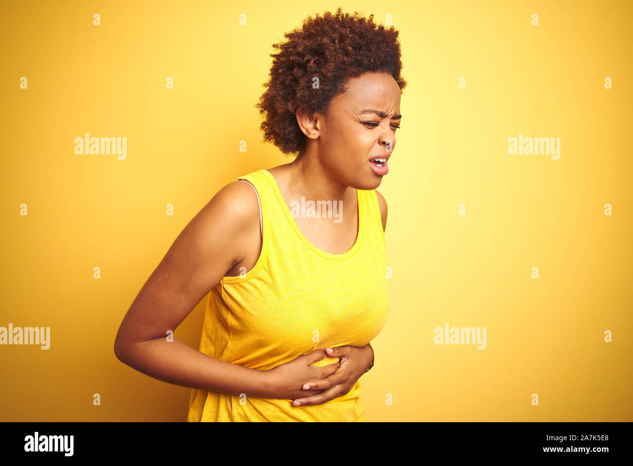 Beauitul african american woman wearing summer t-shirt over isolated ...