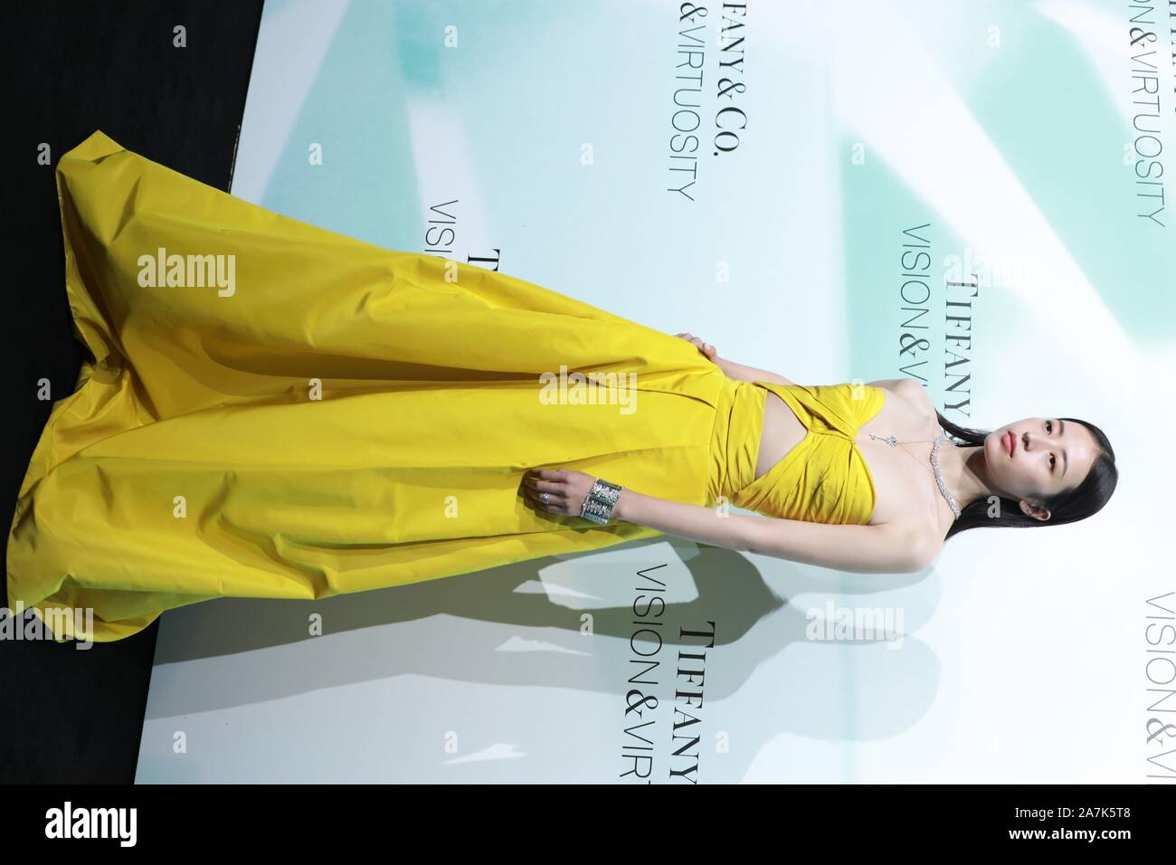 Chinese actress Zhou Yutong wears a bright yellow dress attending the ...