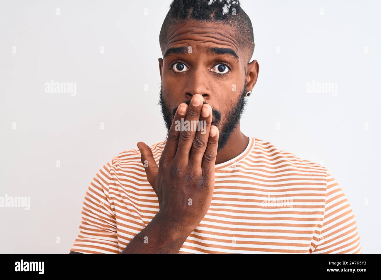 African american man with braids wearing striped t-shirt over isolated ...