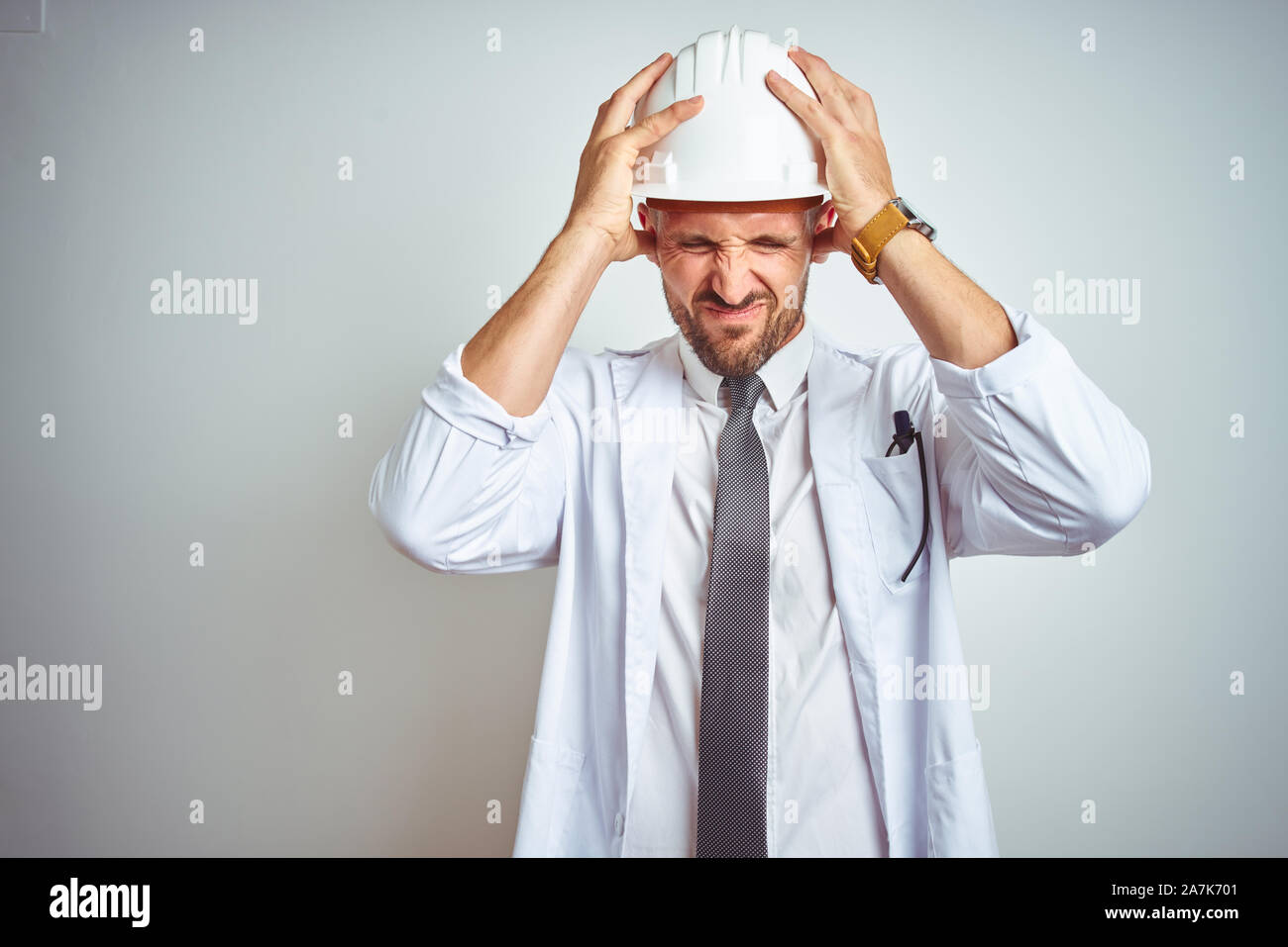 Young handsome engineer man wearing safety helmet over isolated ...