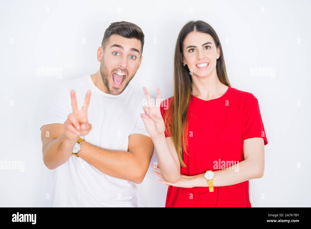 Young beautiful couple together over white isolated background smiling ...