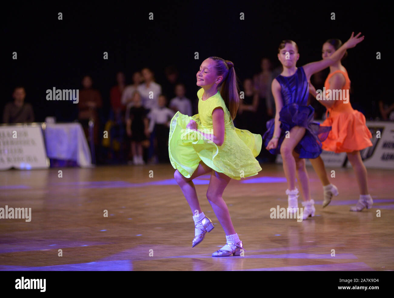 Little girl dancing in the ballroom. Charity ball dedicated to disabled ...