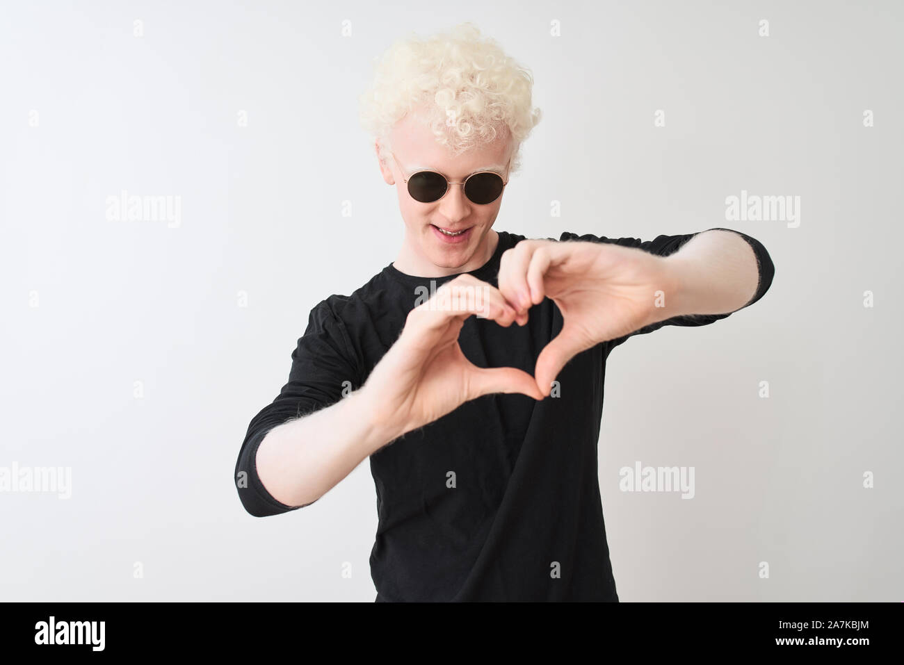 Young albino man wearing black t-shirt and sunglasess standing over ...