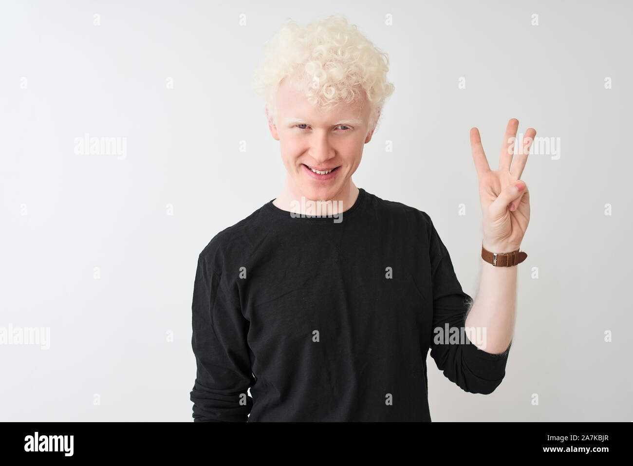 Young albino blond man wearing black t-shirt standing over isolated ...