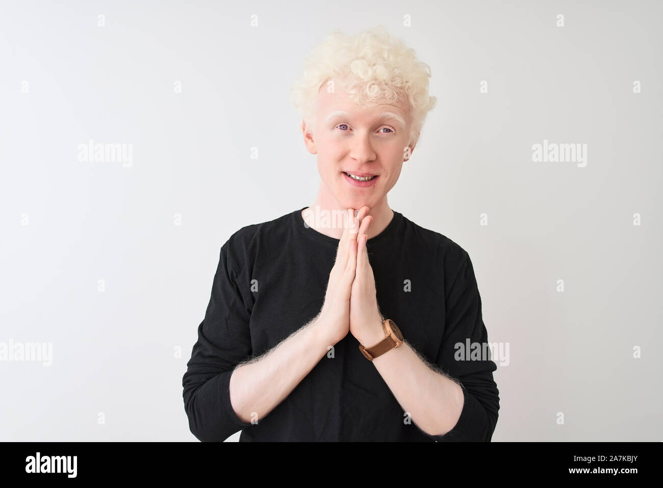 Young albino blond man wearing black t-shirt standing over isolated ...
