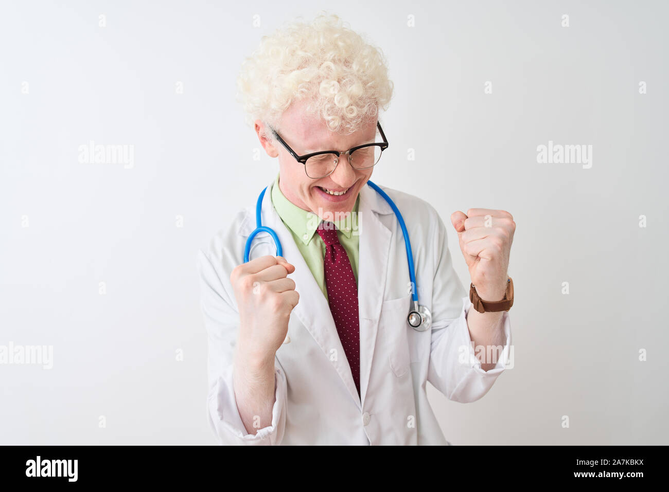Young albino doctor man wearing stethoscope standing over isolated ...