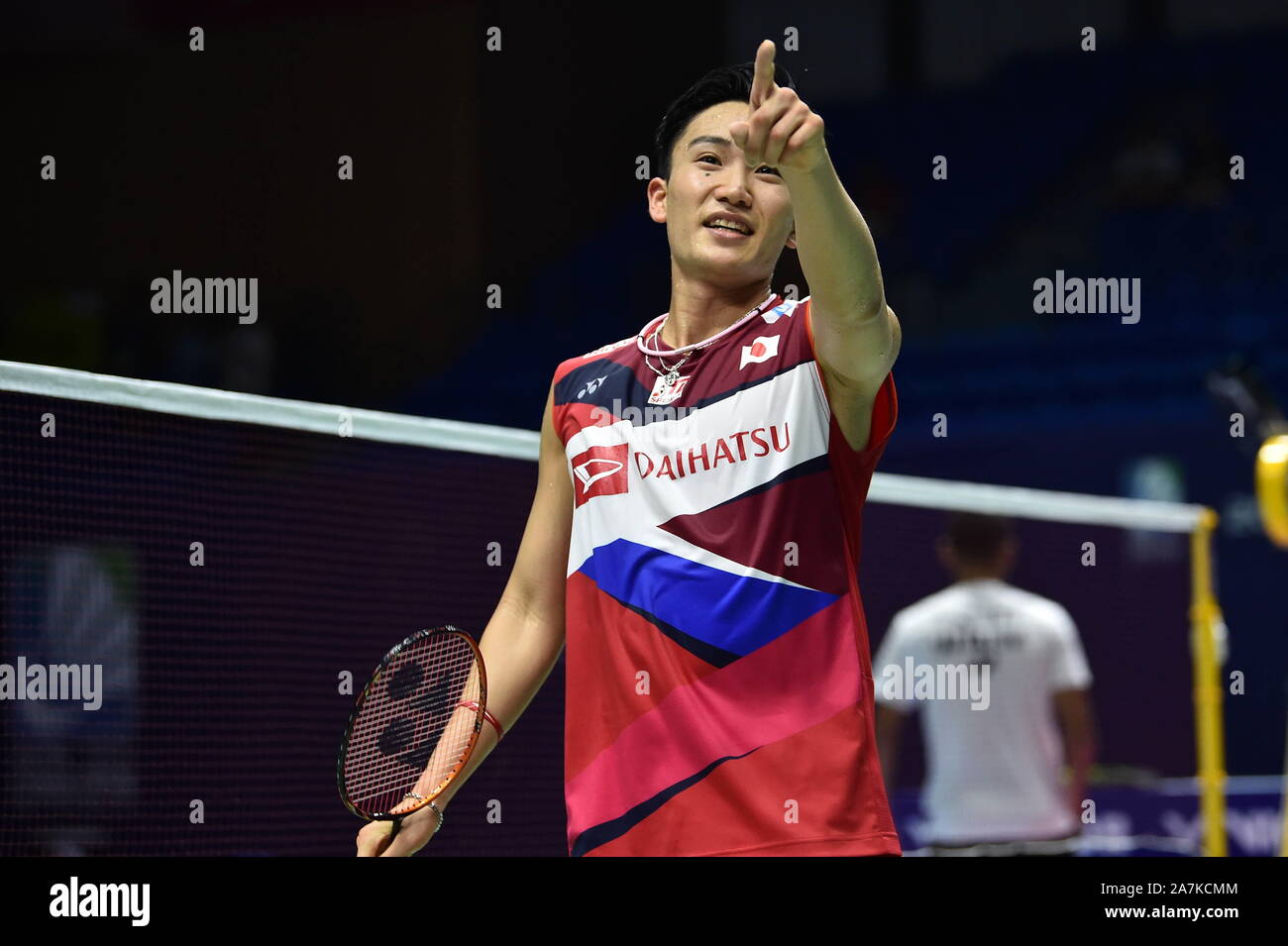 Japanese professional badminton player Kento Momota competes against ...