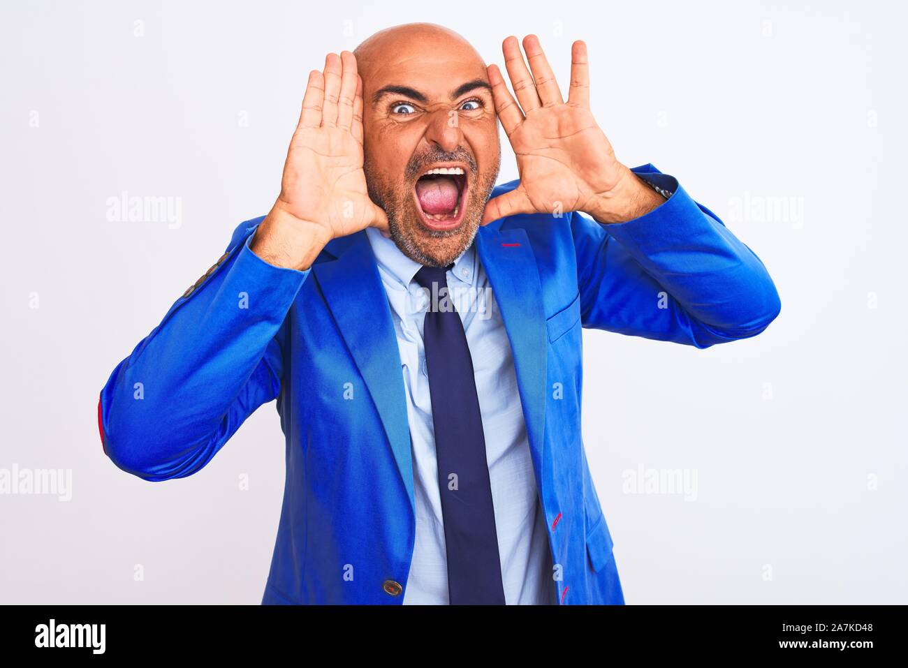 Middle age businessman wearing suit standing over isolated white ...