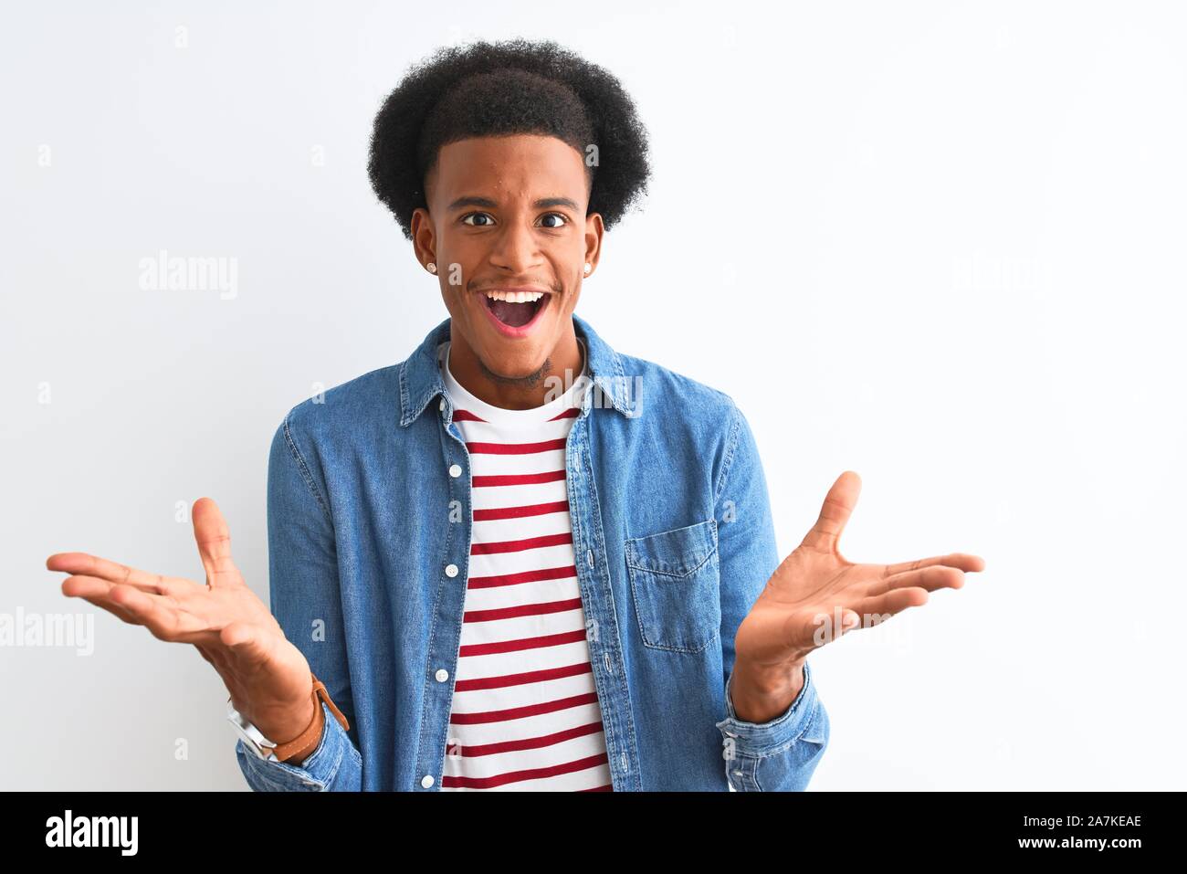 African American Man Wearing Striped T Shirt And Denim Jacket Over