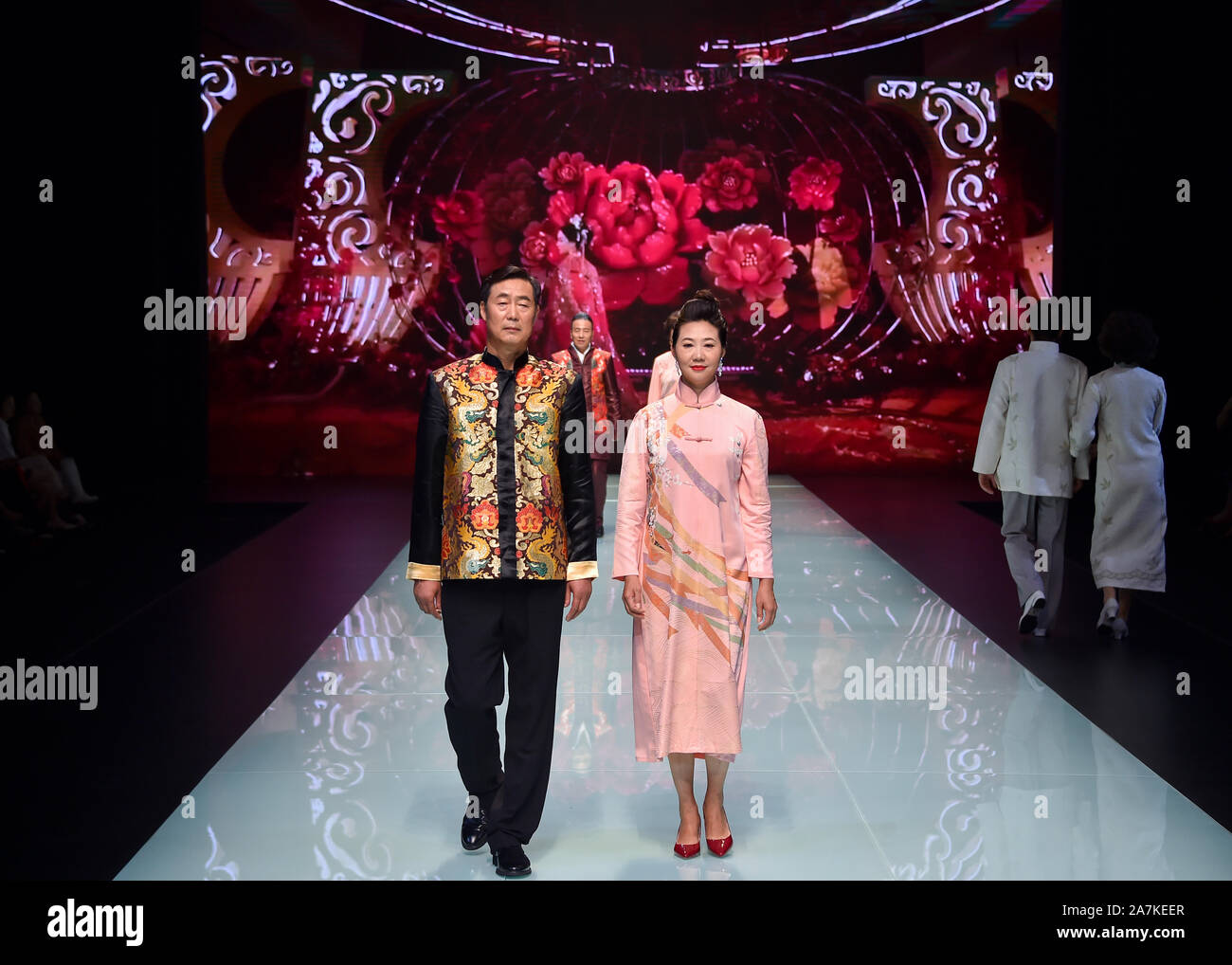 Elder models wearing traditional Chinese outfit designed by Chen Fumei ...