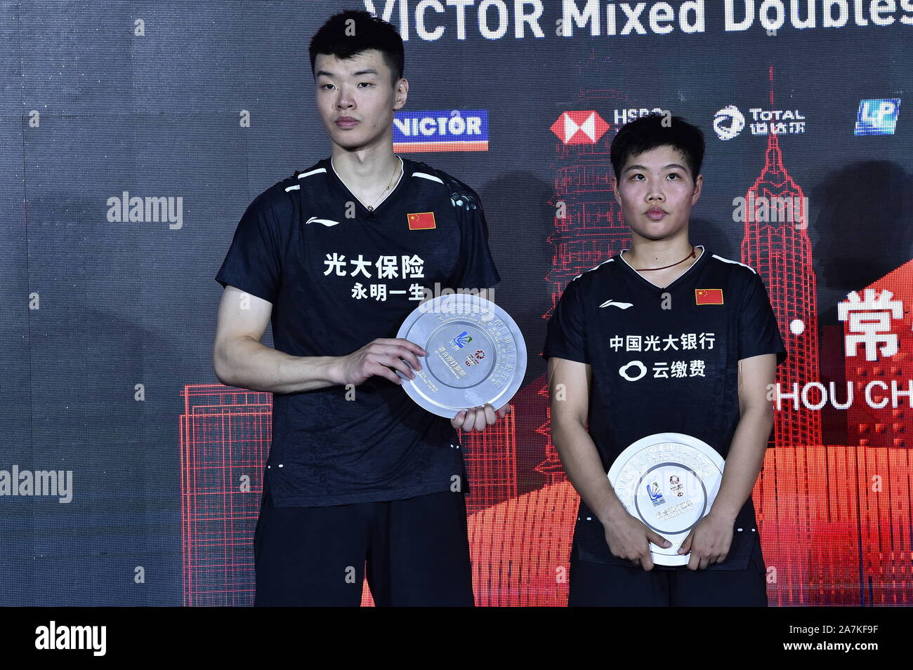 Chinese professional badminton players Wang Yilv, left, and Huang ...