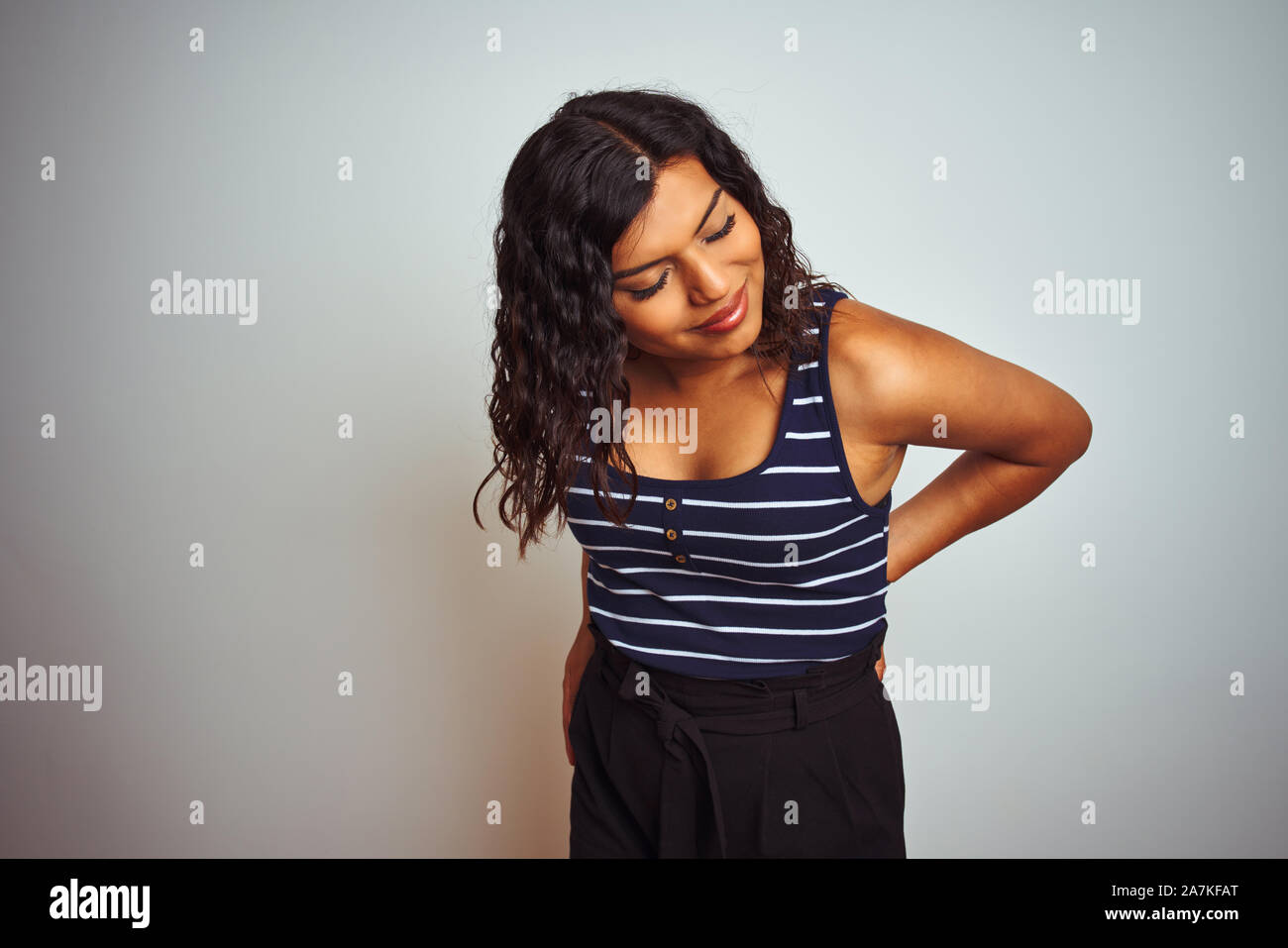 Transsexual transgender woman wearing striped t-shirt over isolated ...