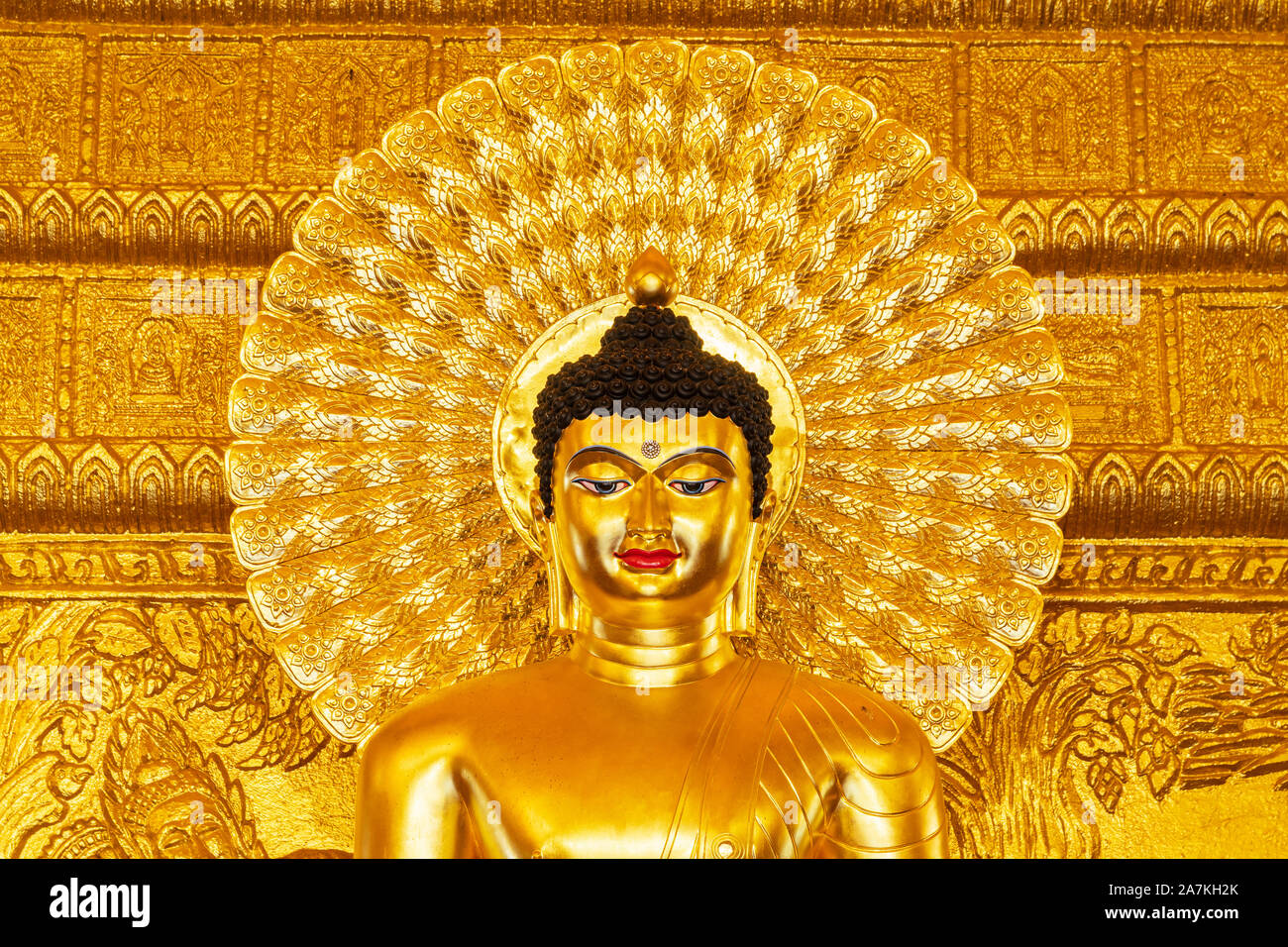 Beautiful golden buddha statue on the wall background are beautifully ...