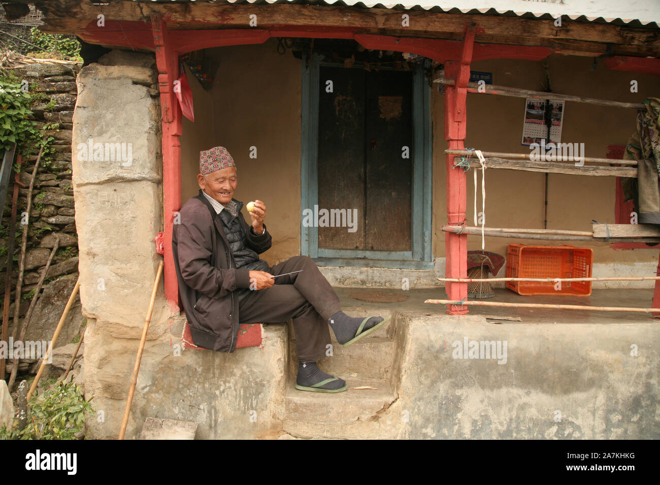 A Gurung man outside his home in Sikles, Himalayas, Nepal Stock Photo ...