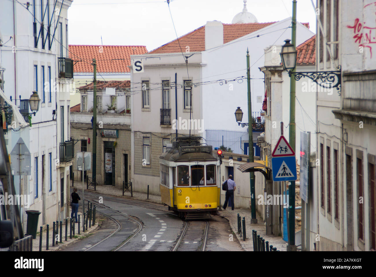 Lisbon yellow tram and historical center Stock Photo - Alamy
