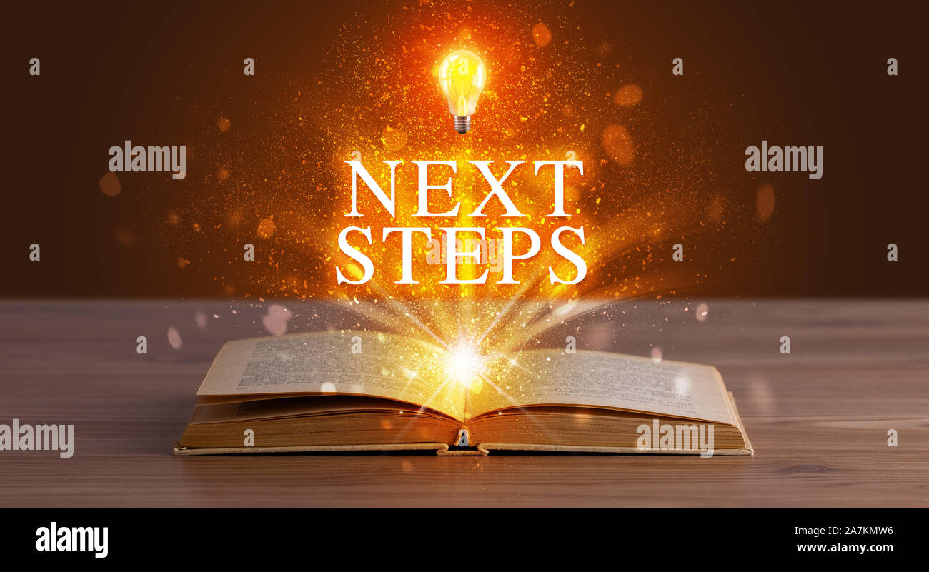 NEXT STEPS inscription coming out from an open book, educational ...