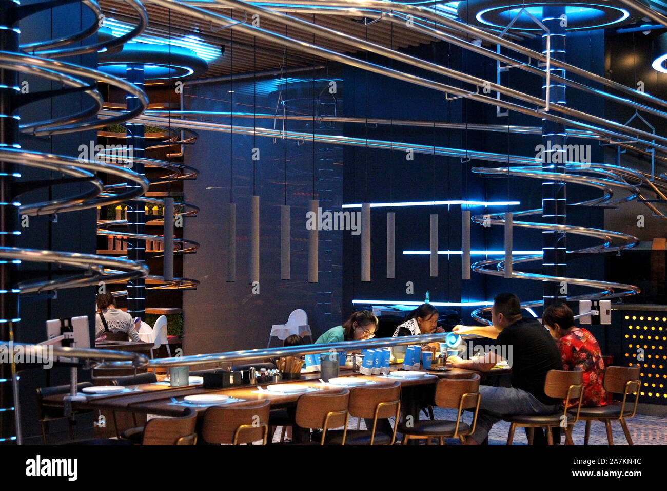 People eat in SpaceLab, a space-themed restaurant featuring gravity ...