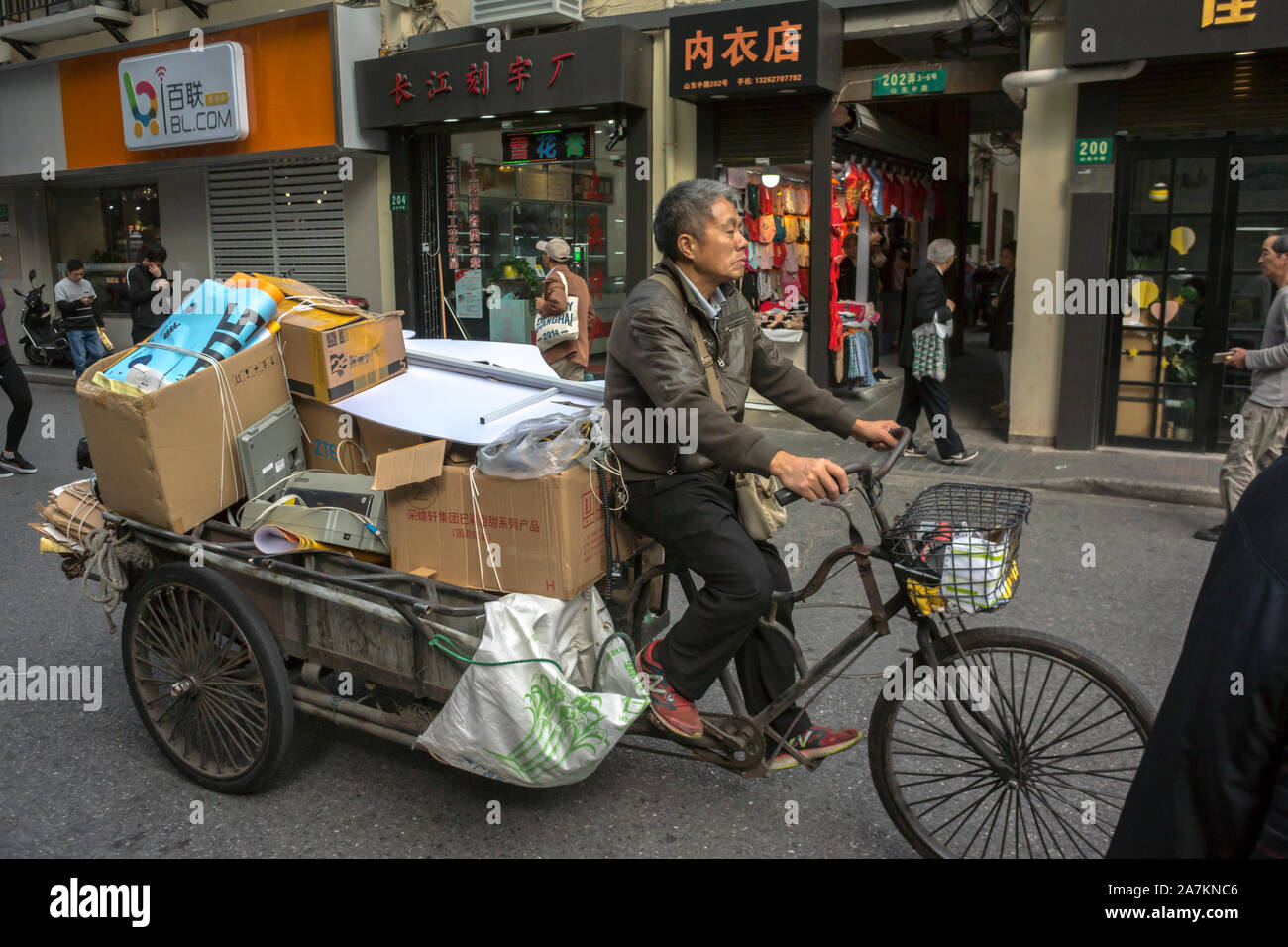 Old chinese man riding bicycle hi-res stock photography and images - Alamy
