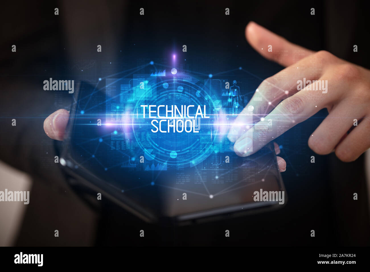 Young man holding a foldable smartphone with TECHNICAL SCHOOL ...