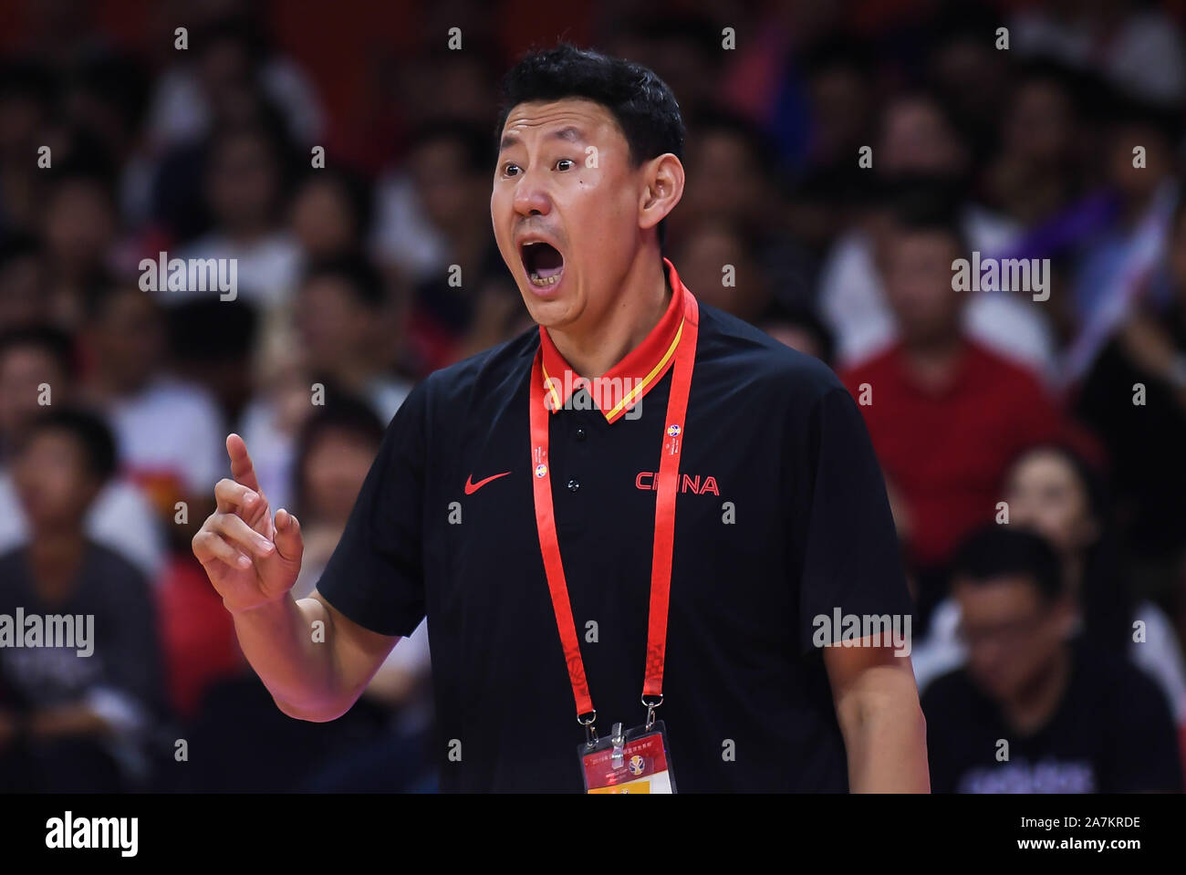 --FILE--Coach Li Nan reacts during a qualification match against South ...