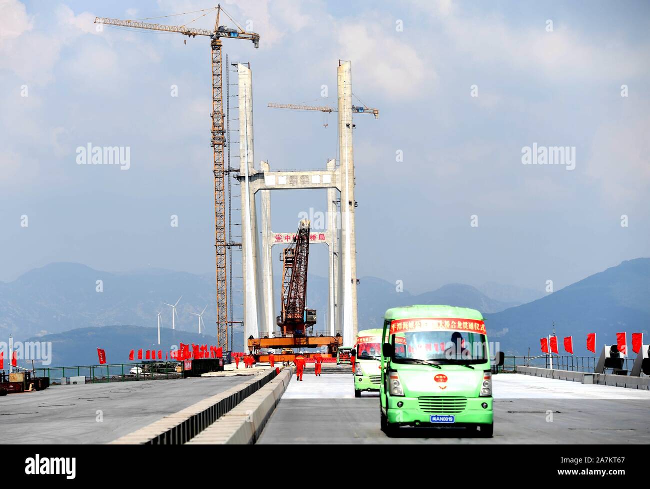 Chinese workers labor at the Pingtan Strait Road-rail Bridge, the world ...