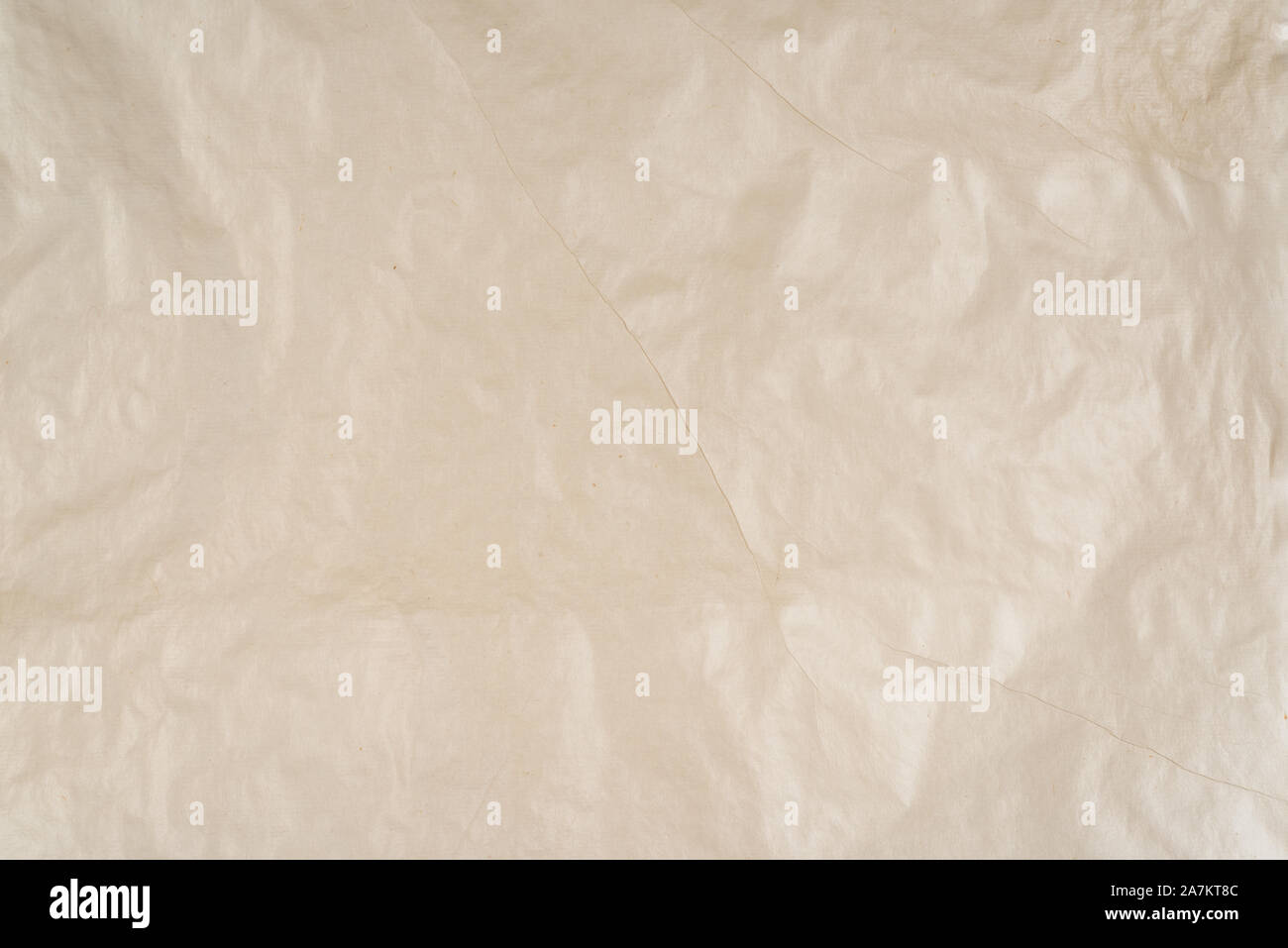 A yellow sheet of paper with slight bends Stock Photo - Alamy