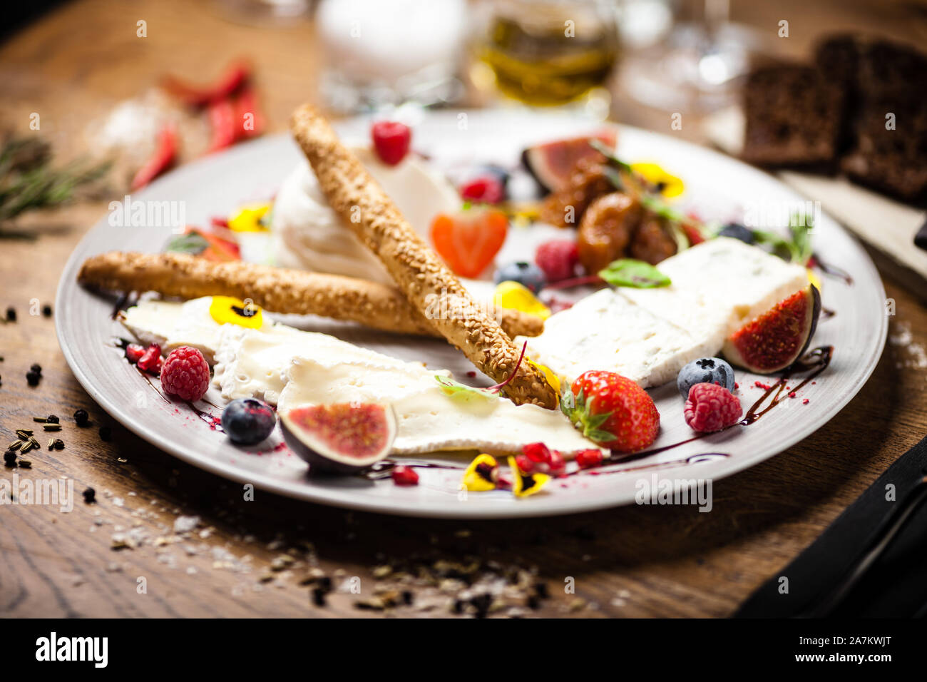 Cheese platter for two served on a plate in restaurant Stock Photo - Alamy
