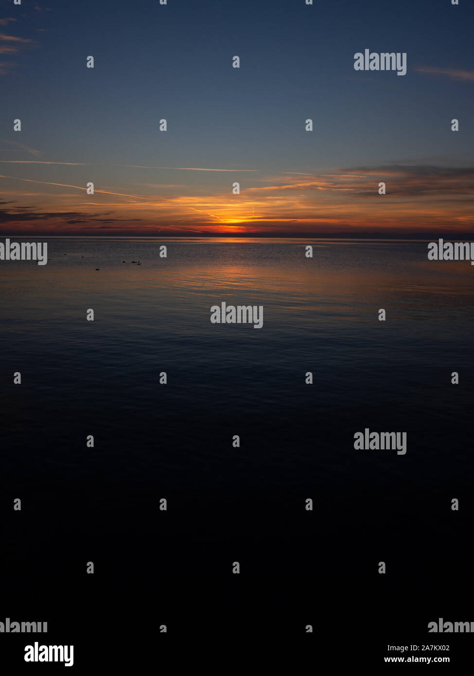 Bright sunset colours on lake hi-res stock photography and images - Alamy