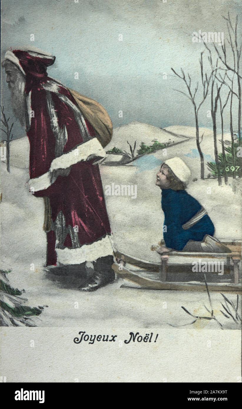 Old French postcard image of Father Christmas and young child Stock ...