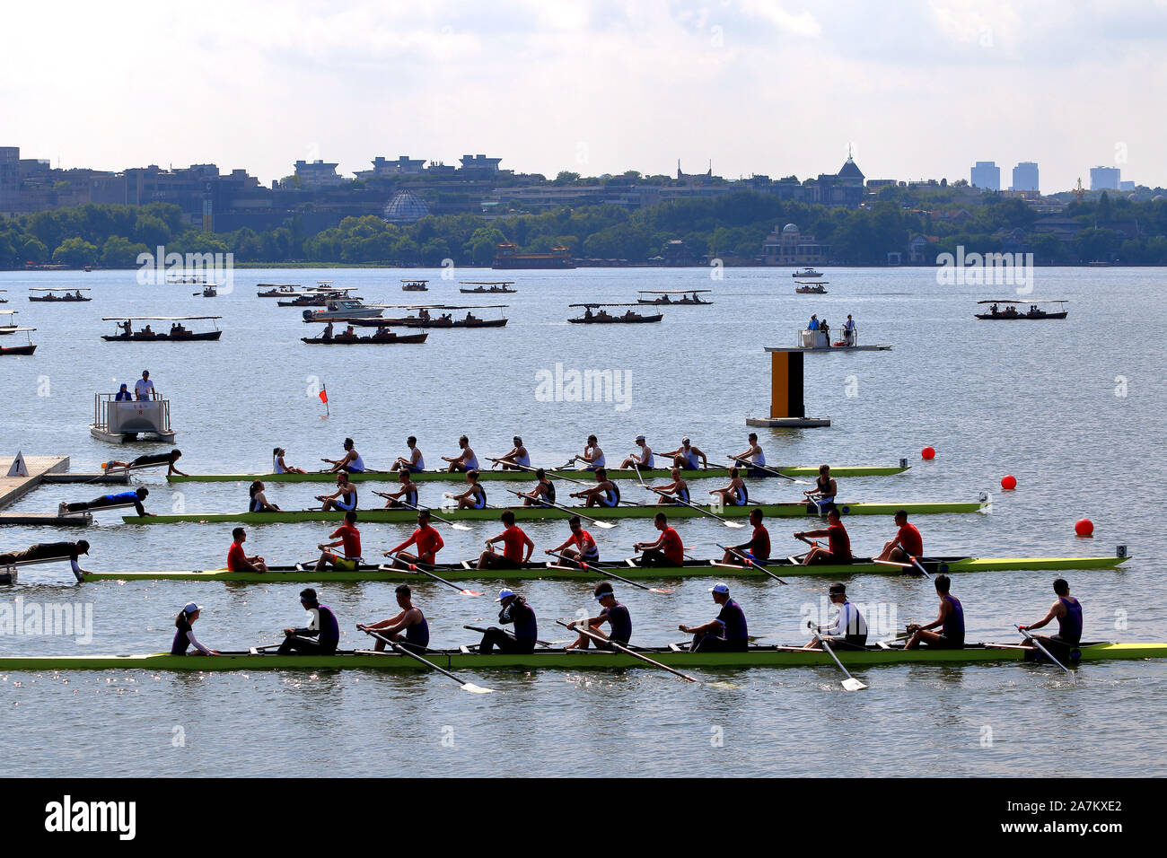 Four rowing teams compete against each other at the West-lake during ...